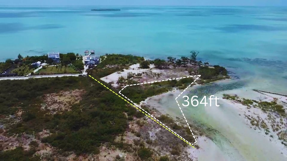 Panoramic waterfront lot on the coveted northeast end of Secret Beach ...